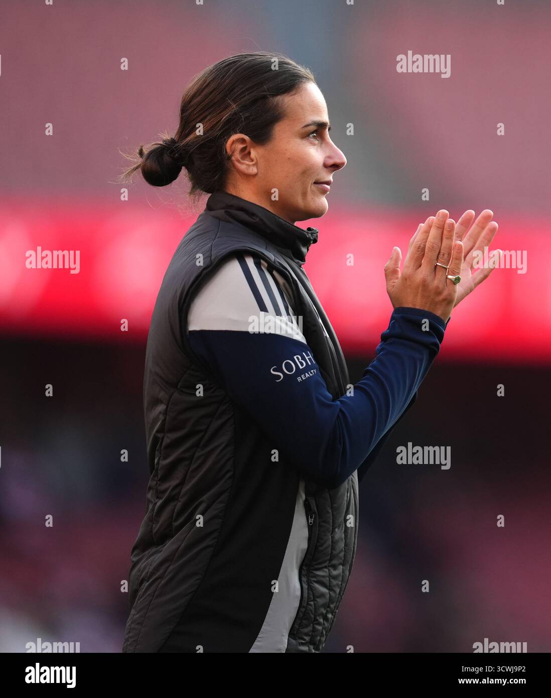 Arsenal manager Renee Slegers applauds the fans following victory in ...