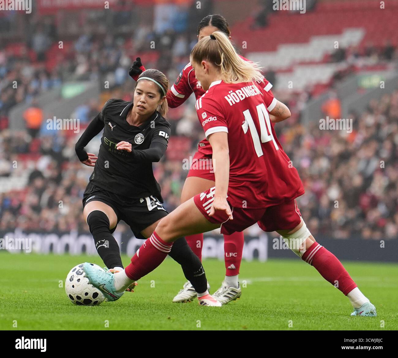Liverpool's Marie Hobinger battles for the ball with Manchester City's ...