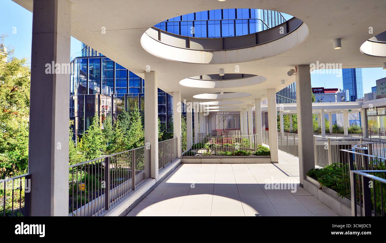 A modern corporate hub in the city center. The structure features a ...