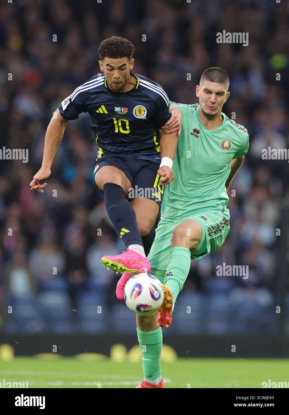 Scotland's Che Adams (left) and Belarus' Egor Parkhomenko (right ...