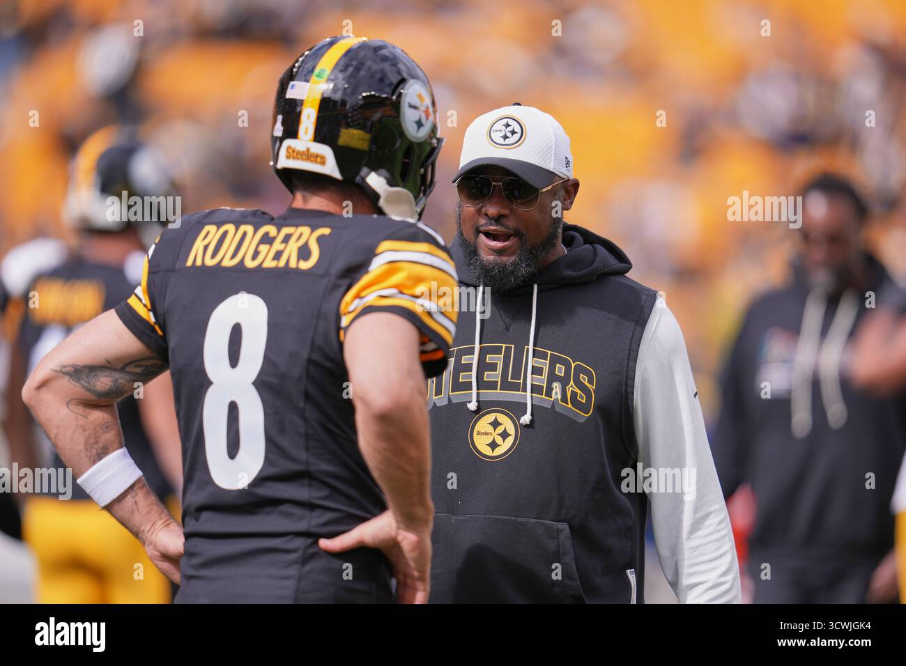 Pittsburgh Steelers quarterback Aaron Rodgers (8) talks with head coach ...