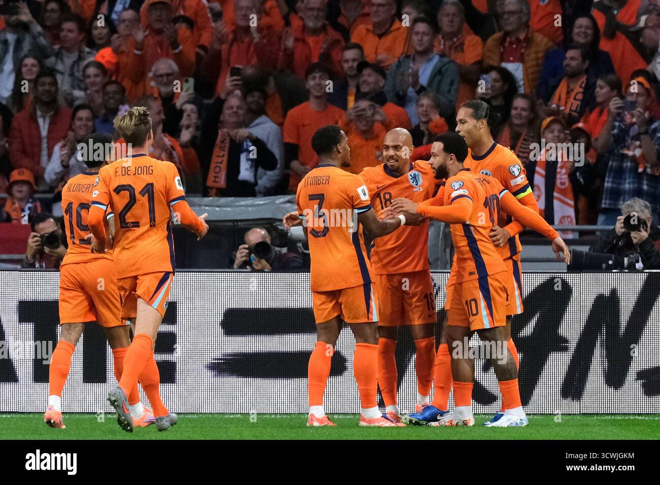 The Netherlands players celebrate after Virgil van Dijk, right, scored ...