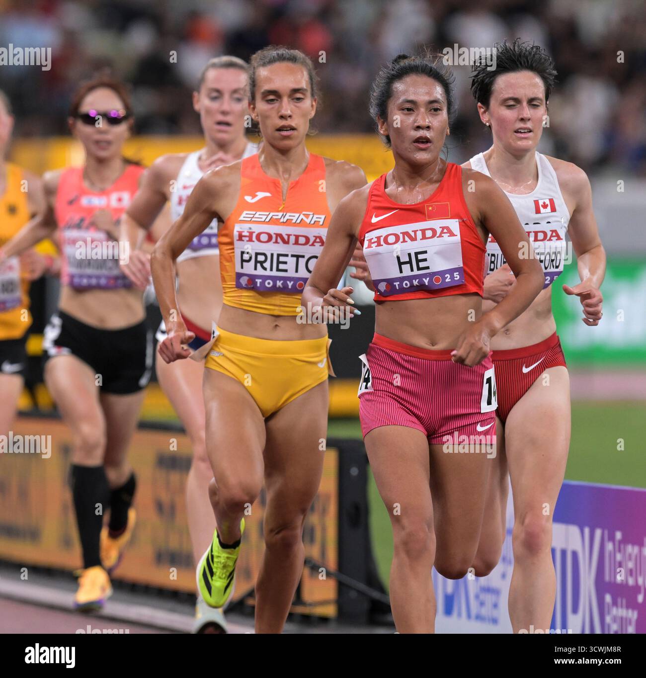 Wuga He of China competing in the women’s 5000m heats at the World ...