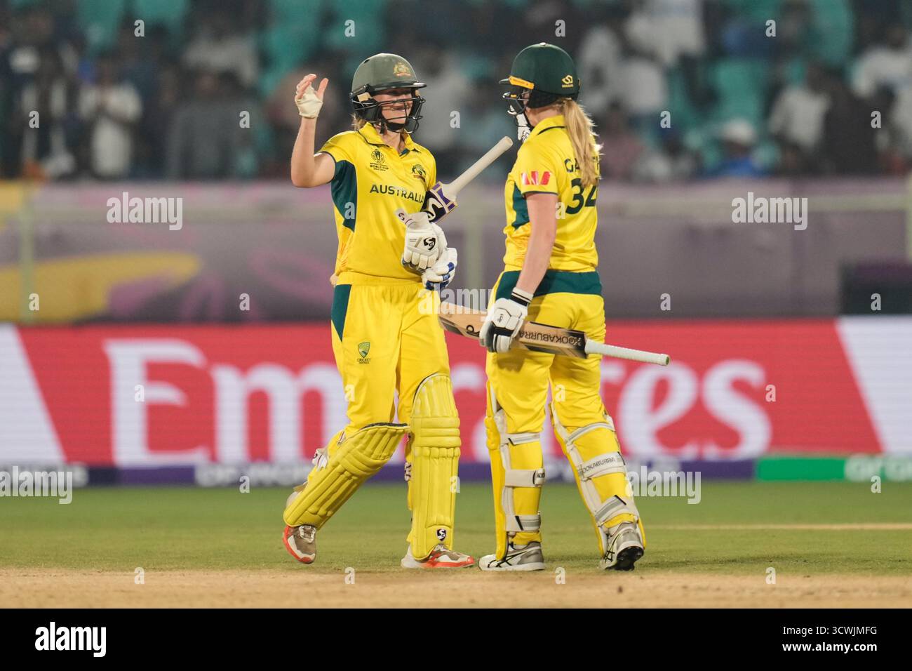 Australia's Ellyse Perry, left, and batting partner Kim Garth celebrate ...