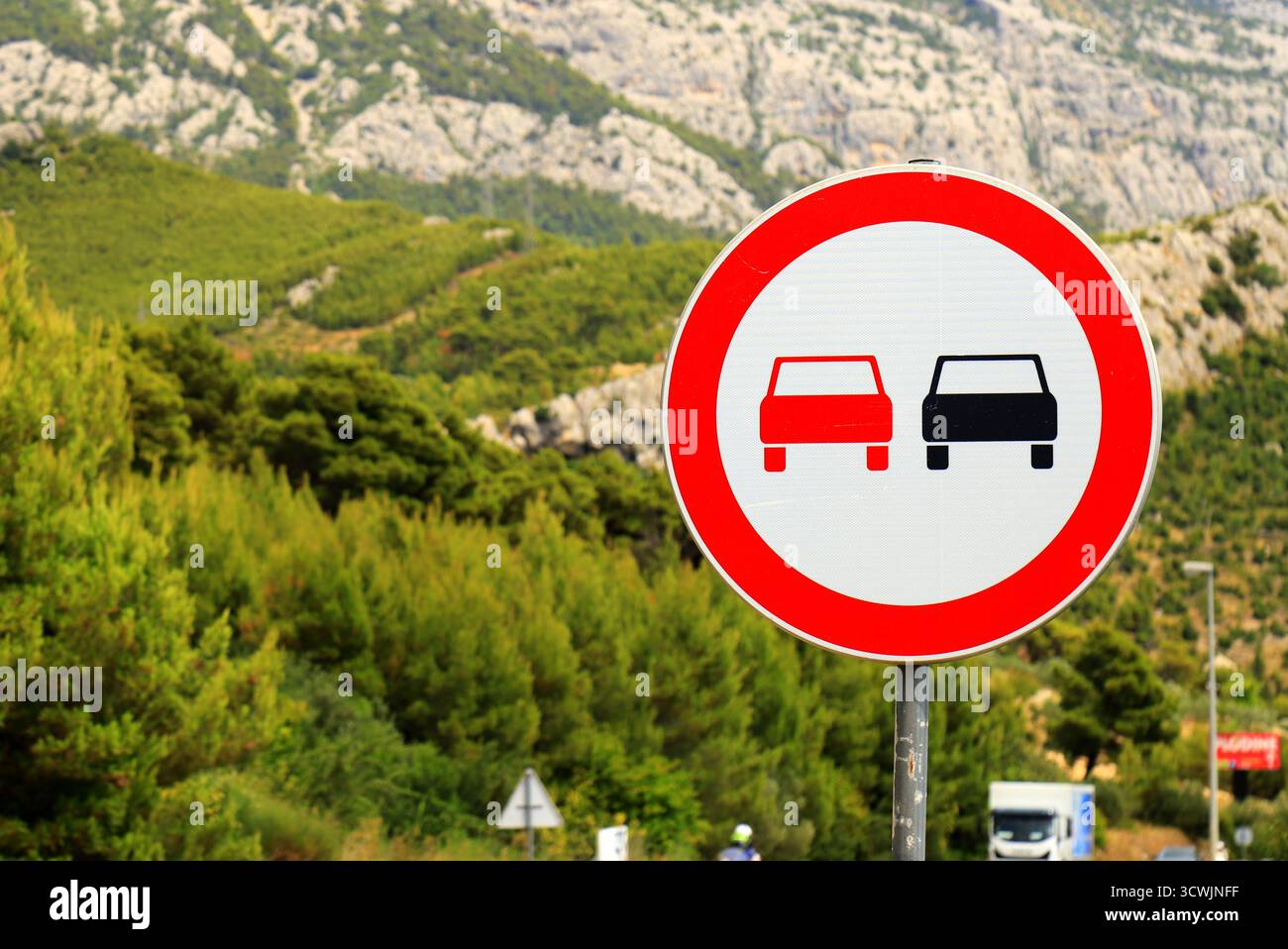 Sign - overtaking is prohibited, on beautiful mountain road in Croatia ...