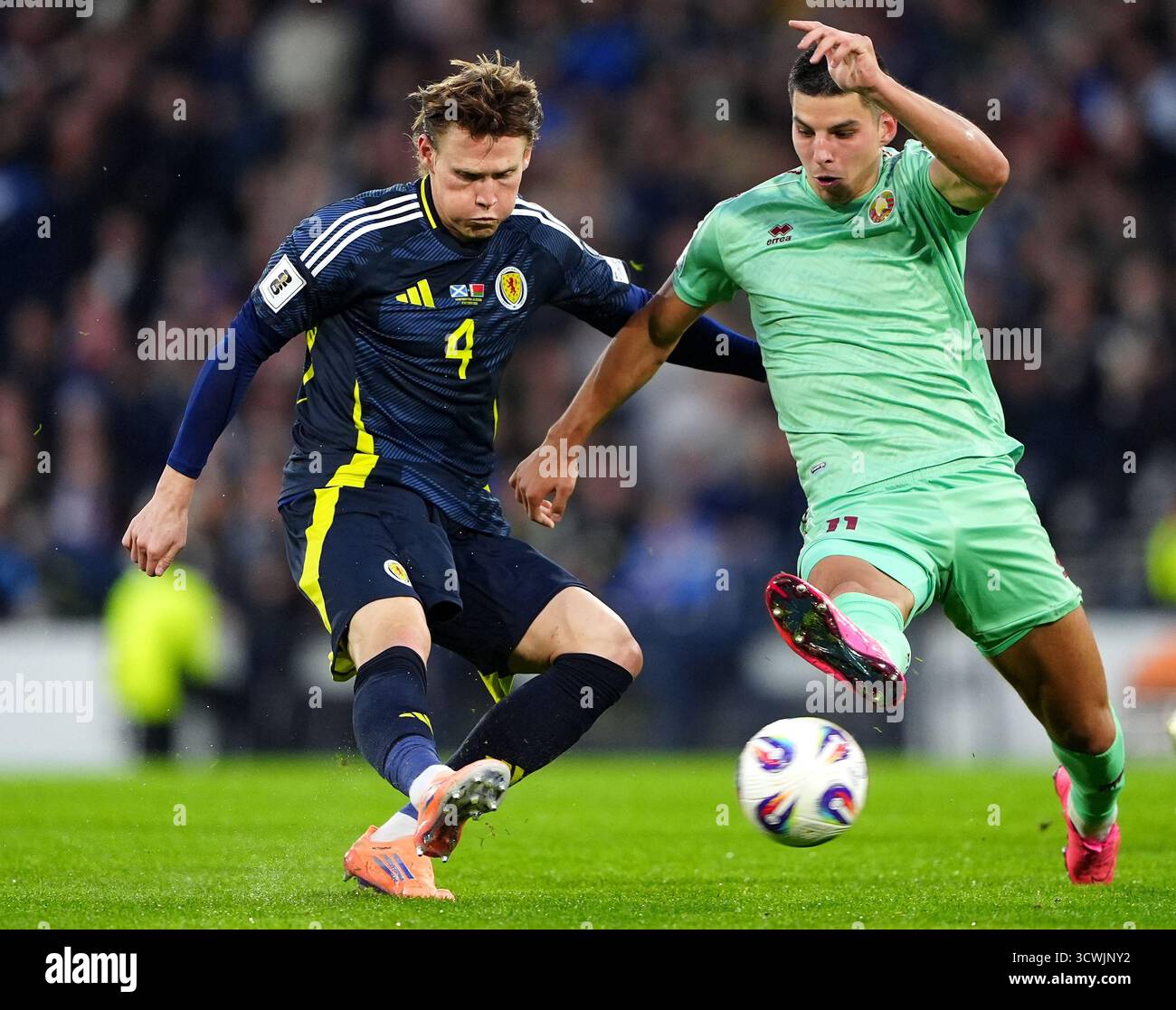 Scotland's Scott McTominay (left) and Belarus' German Barkovsky battle ...