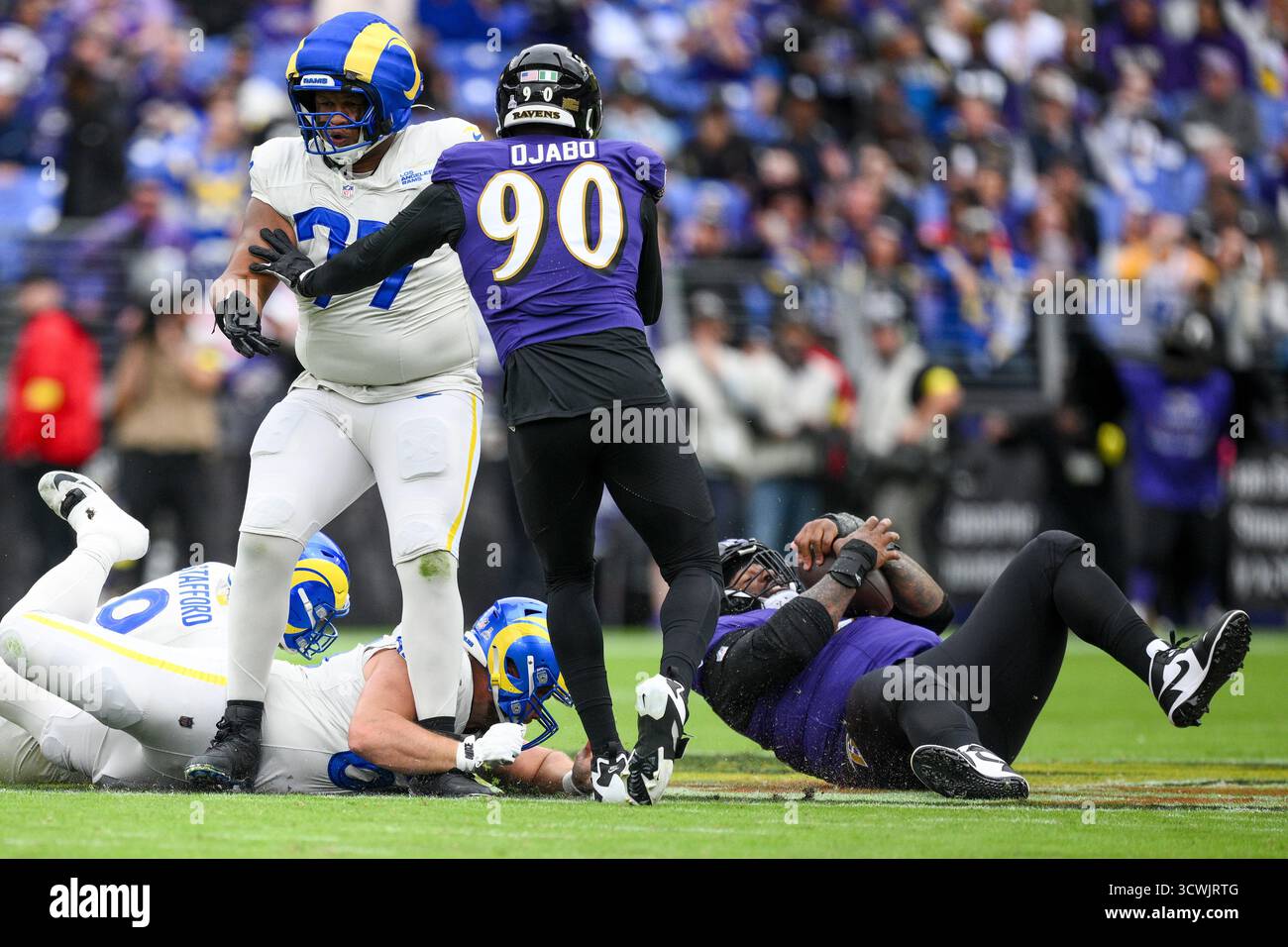 Baltimore Ravens defensive tackle John Jenkins, right, recovers a ...