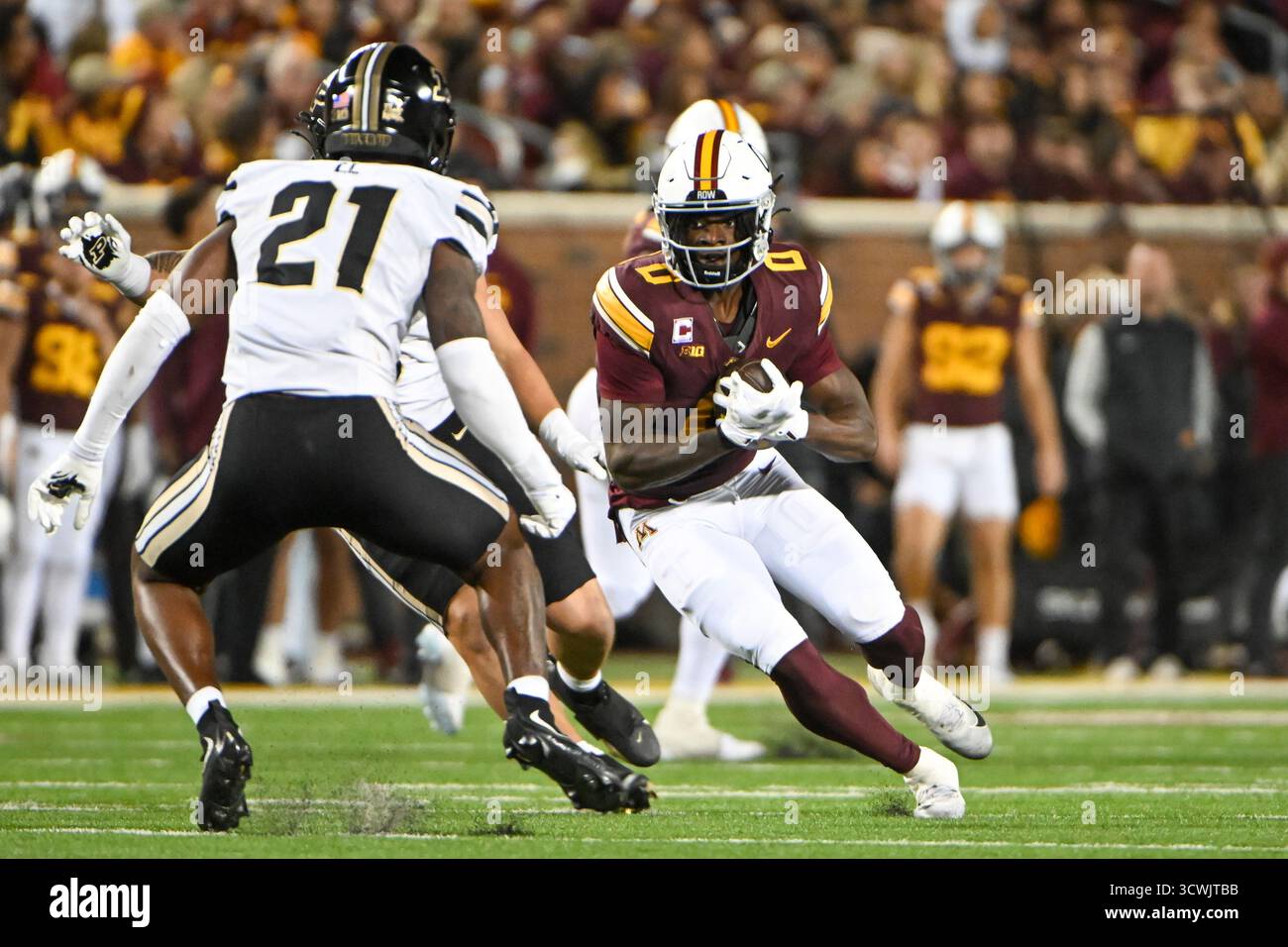 Minnesota wide receiver Lemeke Brockington (0) tries to run past Purdue ...