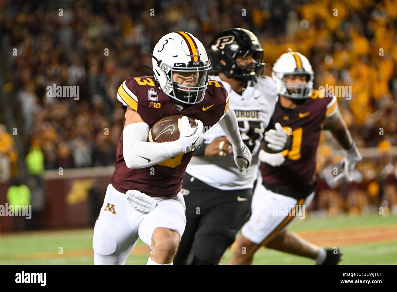 Minnesota defensive back Koi Perich (3) returns an interception for a ...