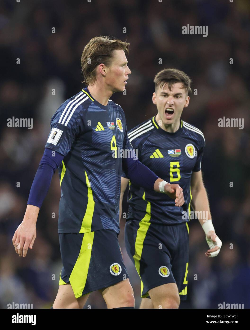 Scotland's Scott McTominay (left) celebrates scoring their side's ...