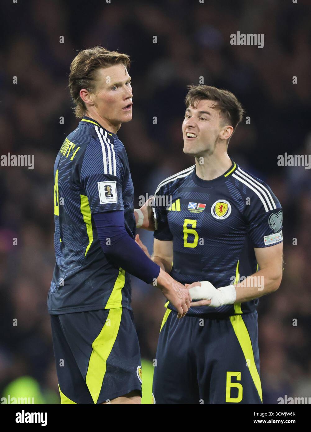 Scotland's Scott McTominay (left) celebrates scoring their side's ...