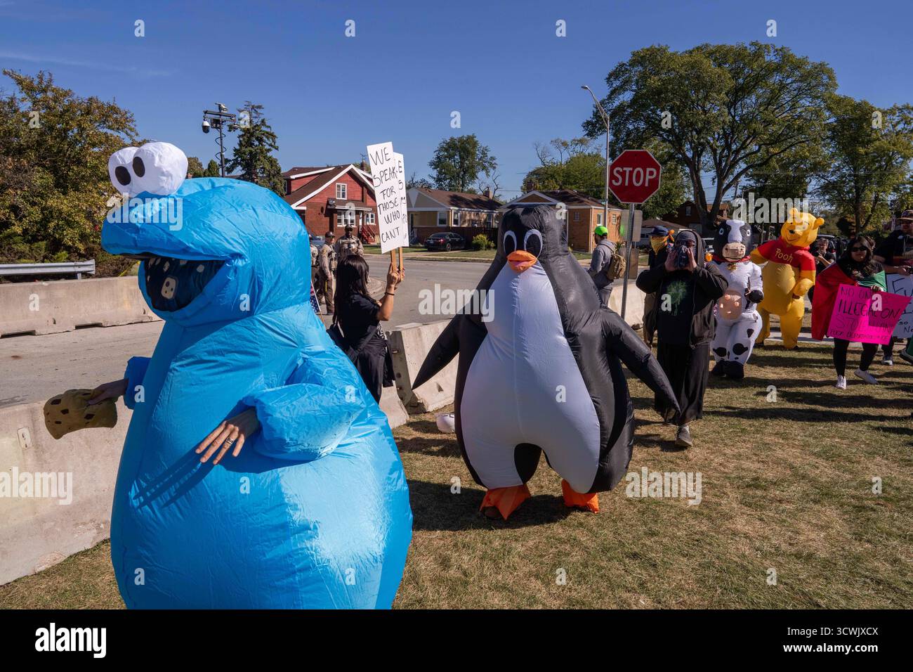 People dressed in inflatable costumes protest outside the U.S ...
