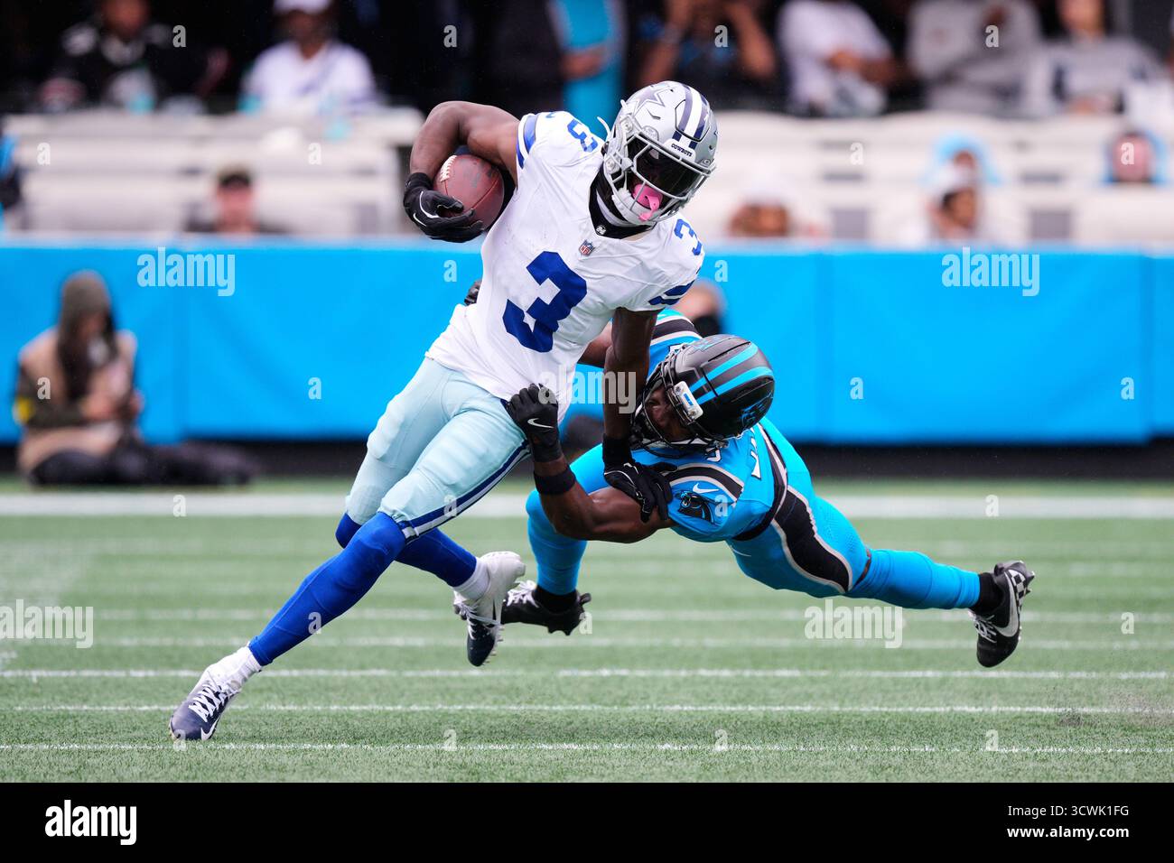 Dallas Cowboys wide receiver George Pickens (3) is tackled by Carolina ...