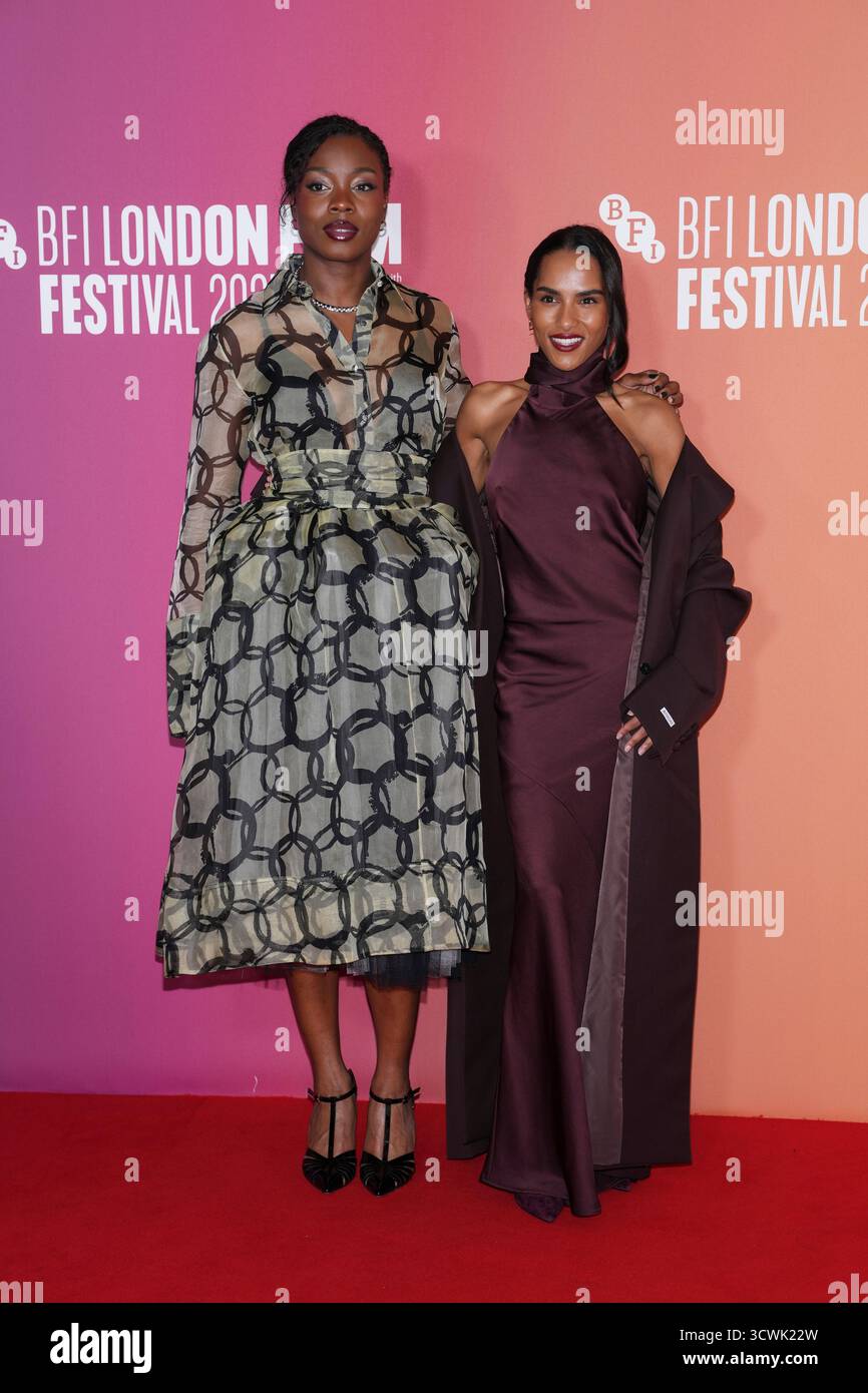 Nia DaCosta, left and Saffron Hocking pose for photographers upon ...