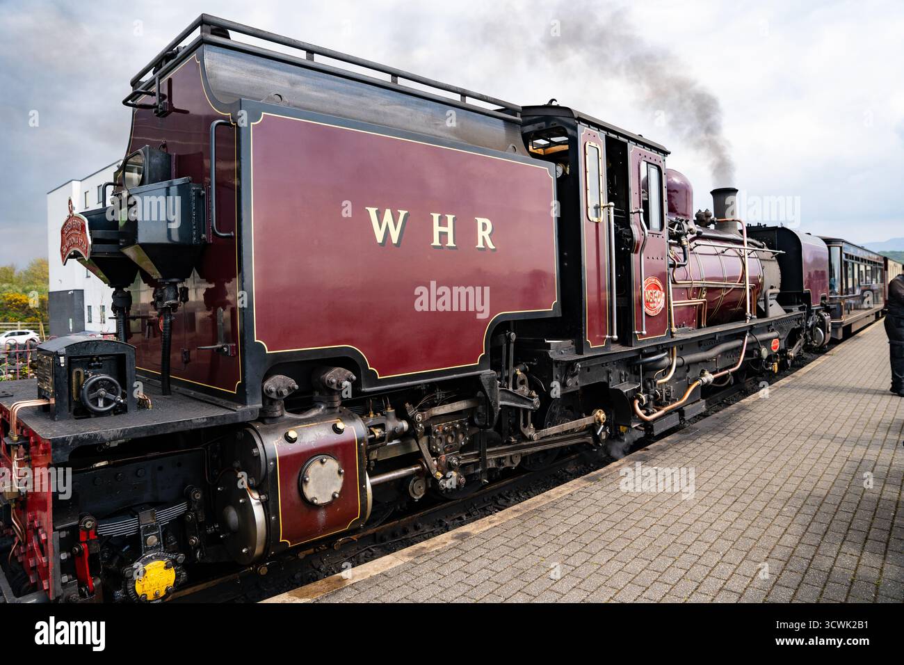WHR steam locomotive with maroon livery at heritage railway platform ...