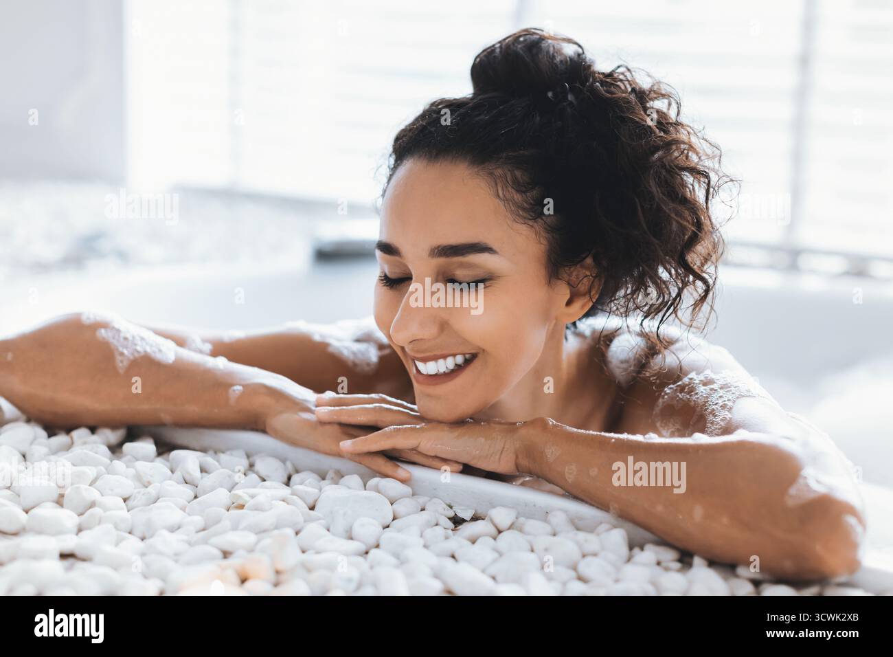 Woman enjoying soothing hair treatment hi-res stock photography and ...