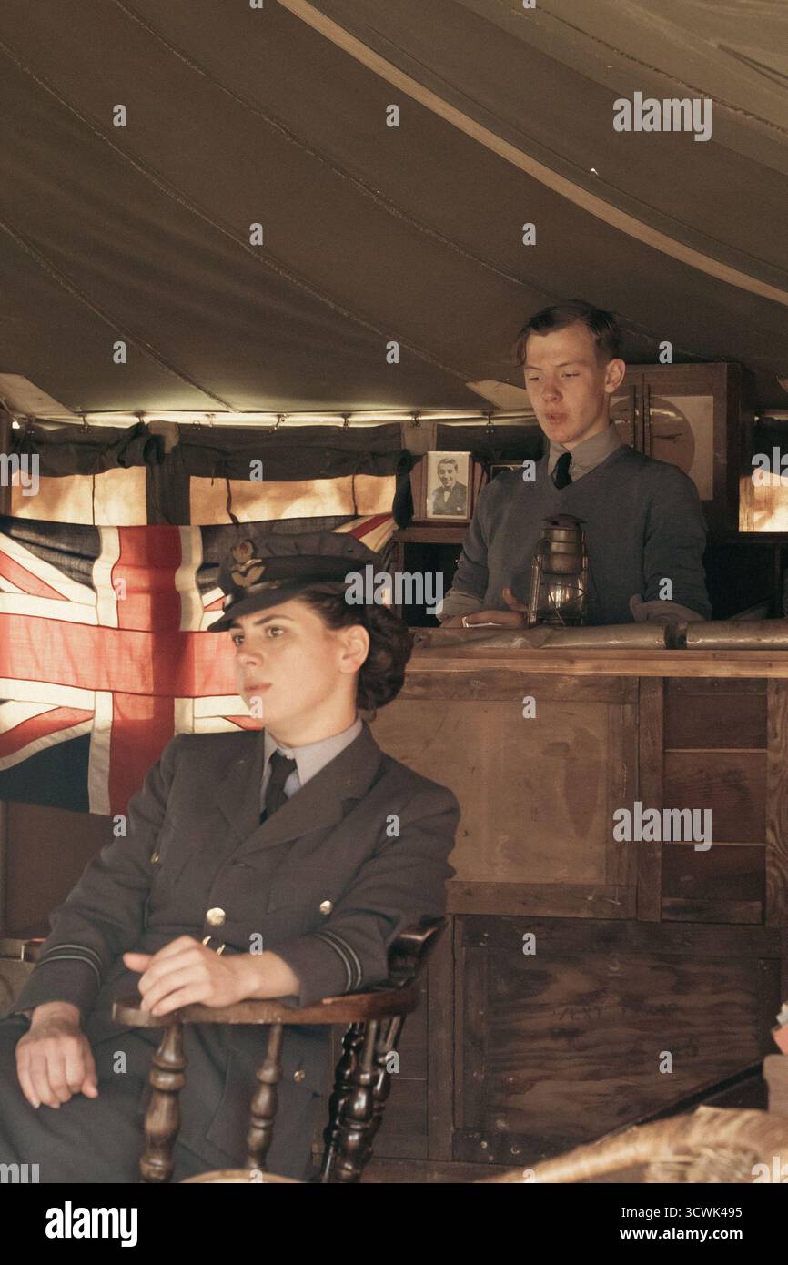 RAF officers in historic wartime ship cabin with Union Jack flag Stock ...