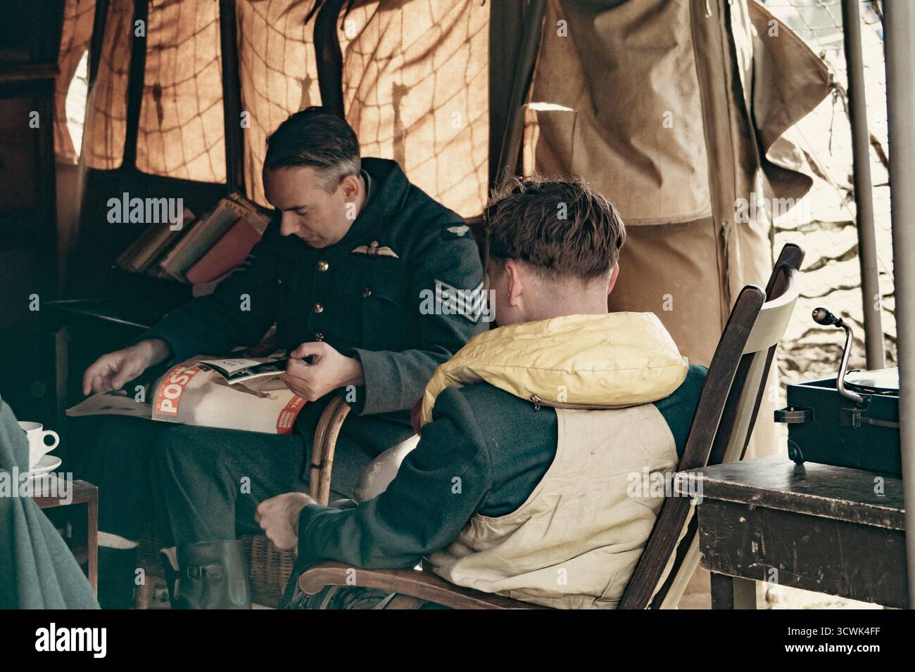 RAF aircrew reading post in wartime tent recreation at Duxford Stock ...