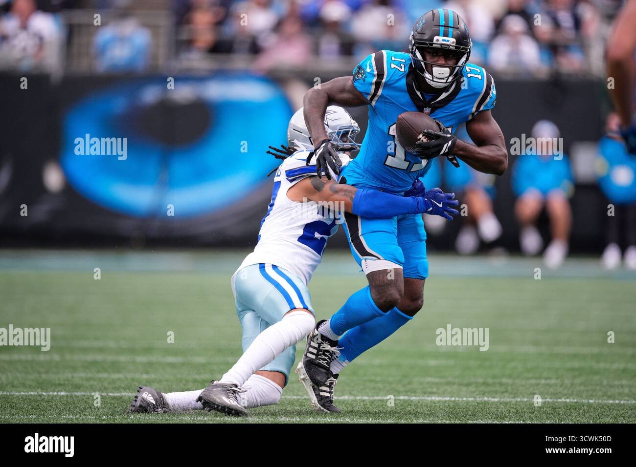Carolina Panthers wide receiver Xavier Legette (17) attempts to escape ...