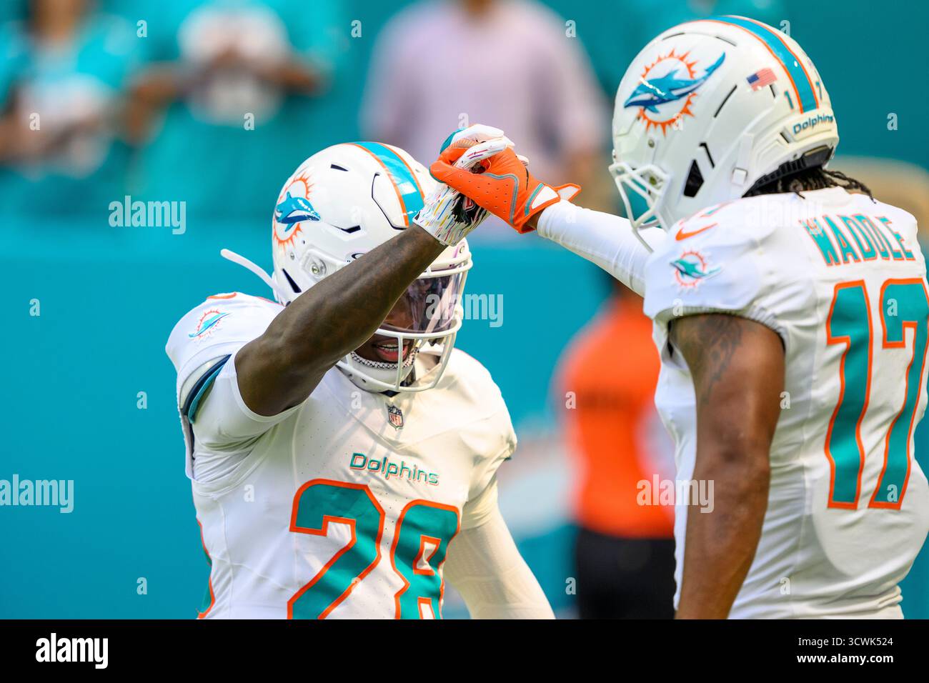 Miami Dolphins running back De'Von Achane (28) celebrates scoring a ...