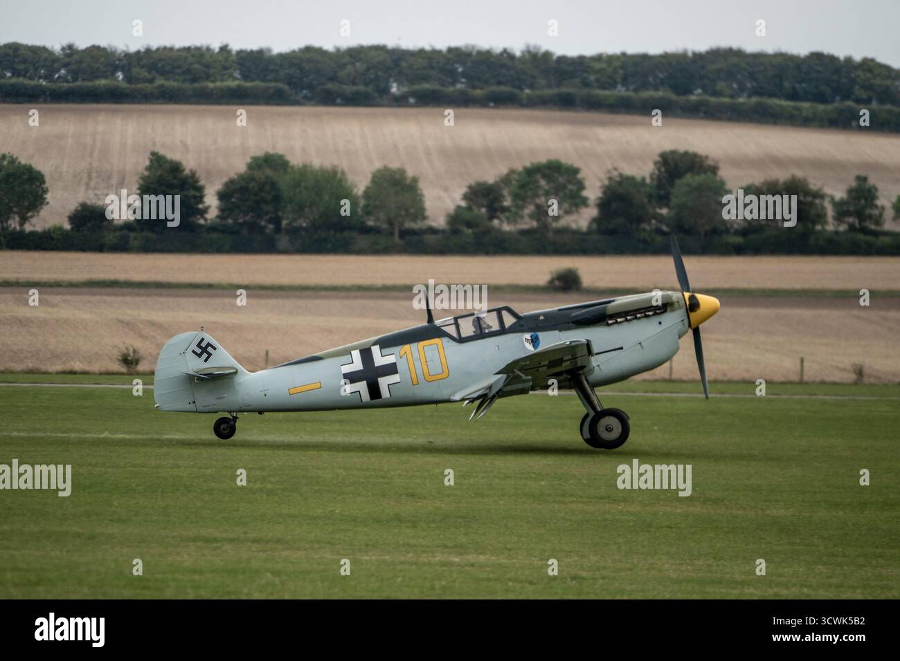 German Messerschmitt Bf 109 fighter aircraft on grass airfield at ...