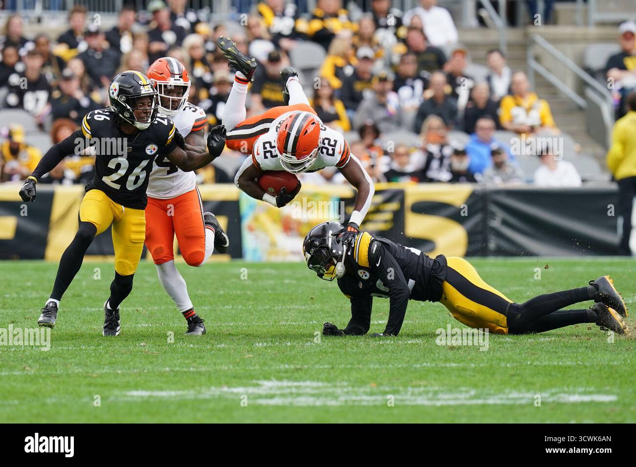 Cleveland Browns running back Dylan Sampson (22) is upended by ...