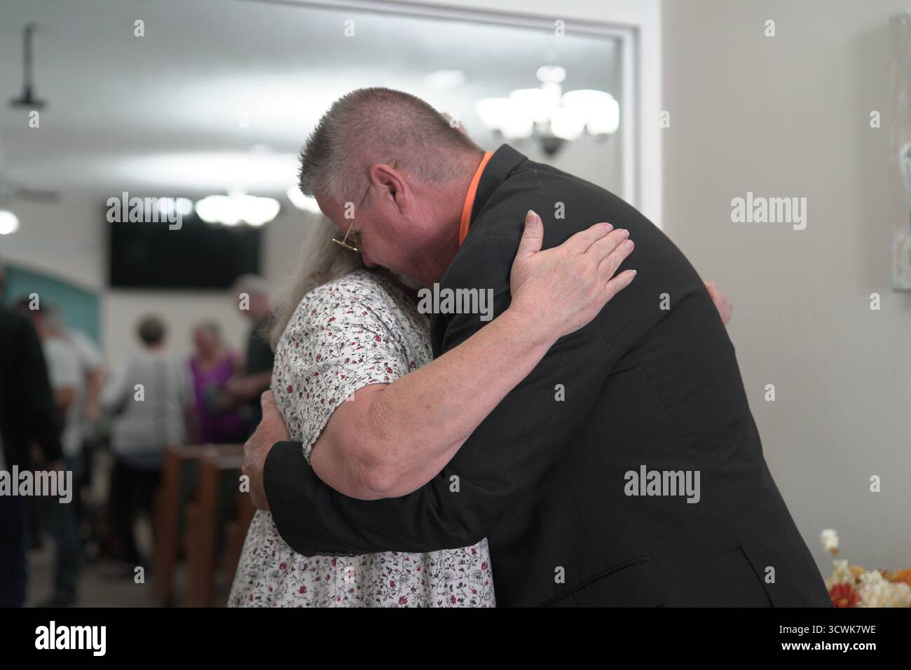 Pastor Jimmy Andrews of Maple Valley Baptist Church comforts a ...