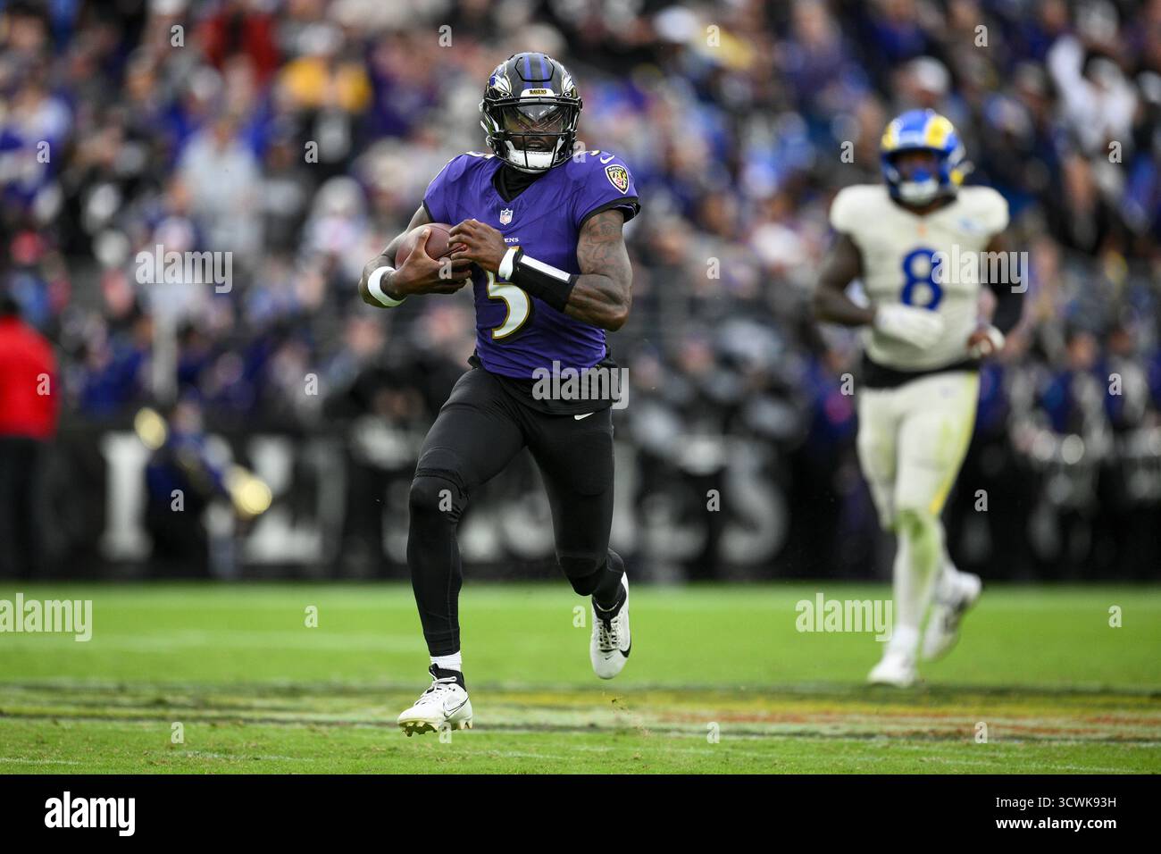 Baltimore Ravens quarterback Tyler Huntley (5) runs with the ball with ...