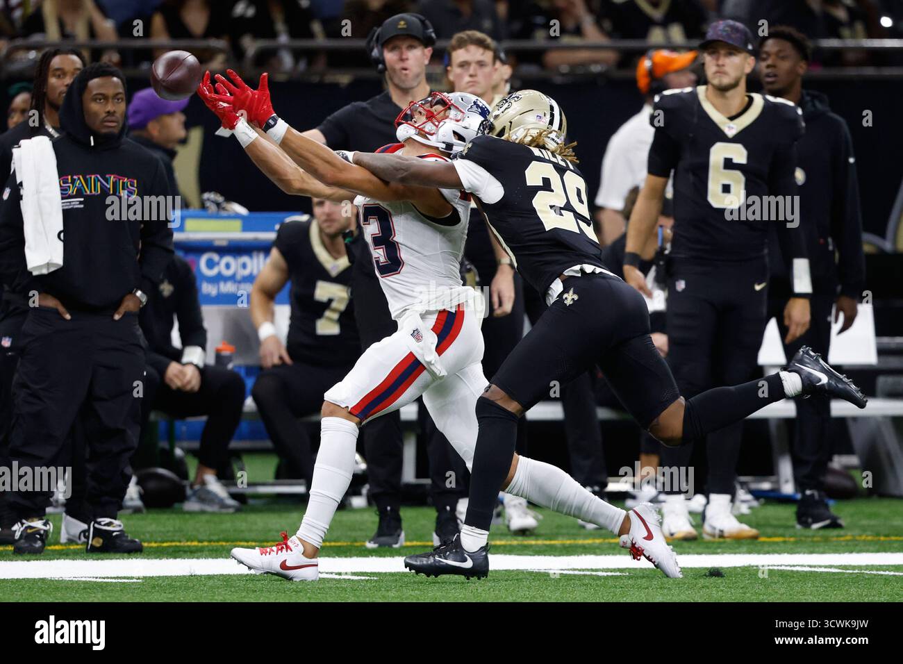 New England Patriots wide receiver Mack Hollins, left, is unable to ...