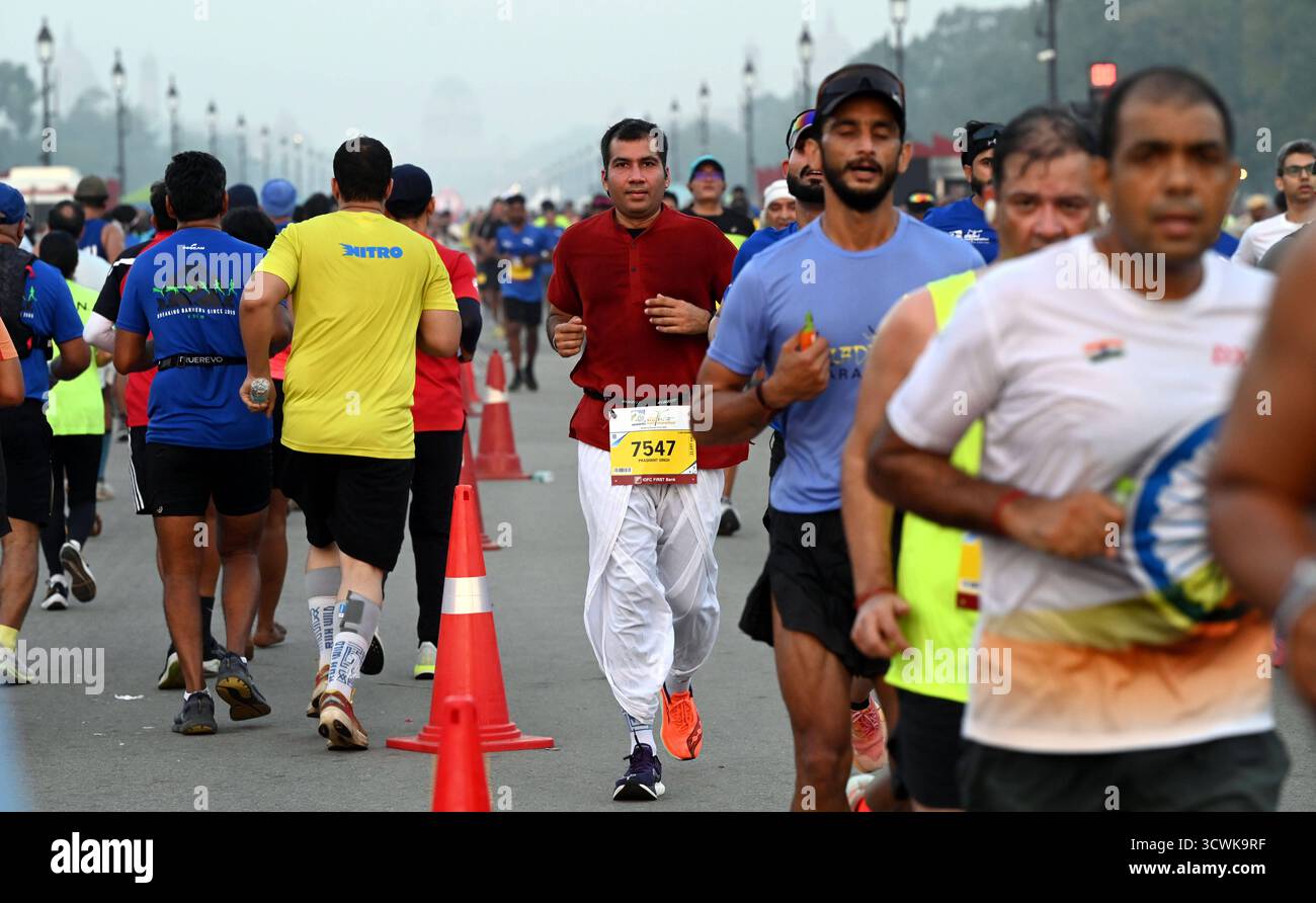NEW DELHI, INDIA - OCTOBER 12: Participants take part in the Vedanta Delhi Half Marathon 2025 at ...