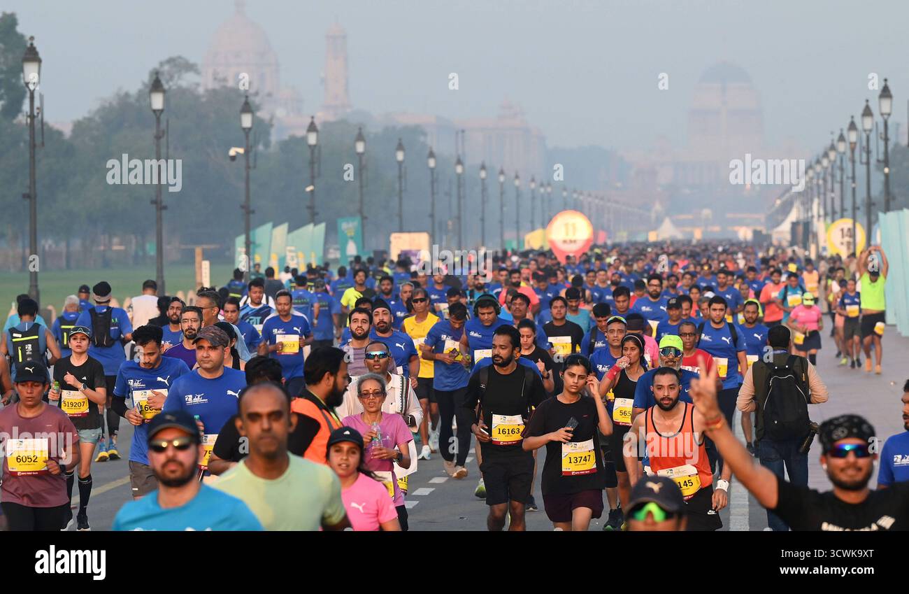 NEW DELHI, INDIA - OCTOBER 12: Participants take part in the Vedanta Delhi Half Marathon 2025 at ...