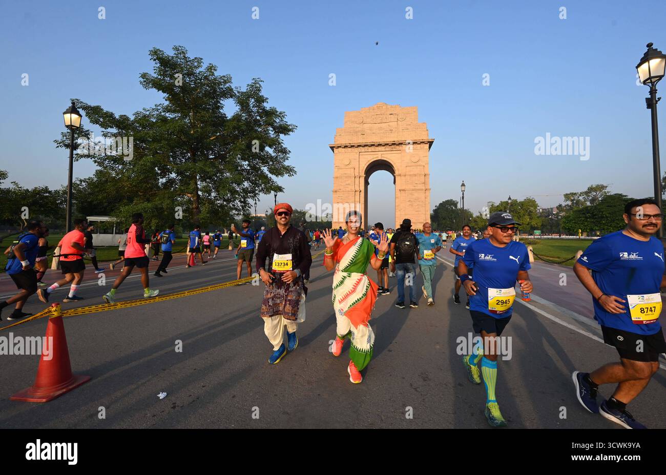 NEW DELHI, INDIA - OCTOBER 12: Participants take part in the Vedanta Delhi Half Marathon 2025 at ...