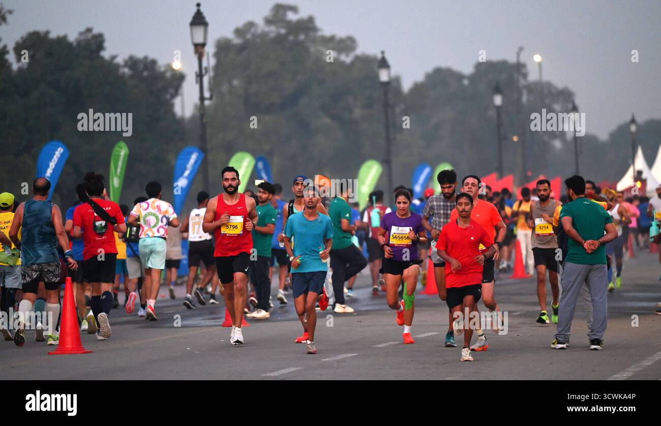 NEW DELHI, INDIA - OCTOBER 12: Participants take part in the Vedanta Delhi Half Marathon 2025 at ...