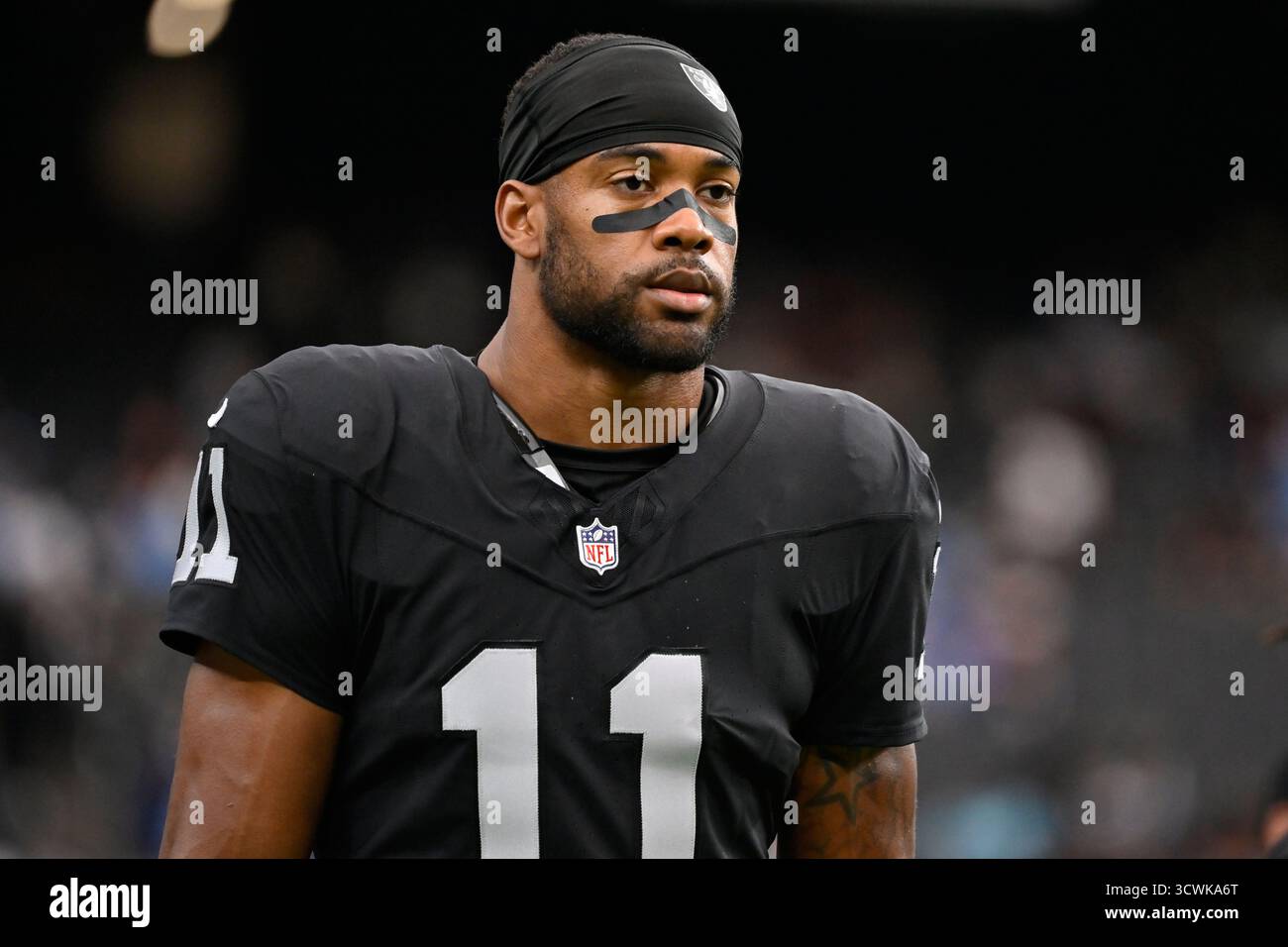 Las Vegas Raiders safety Jeremy Chinn (11) warms up before an NFL ...