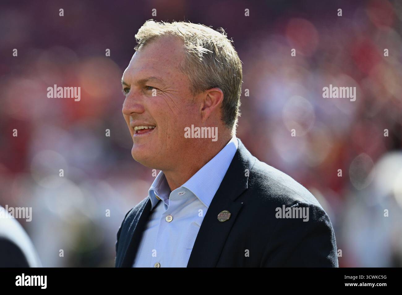 San Francisco 49ers general manager John Lynch watches players warm up ...