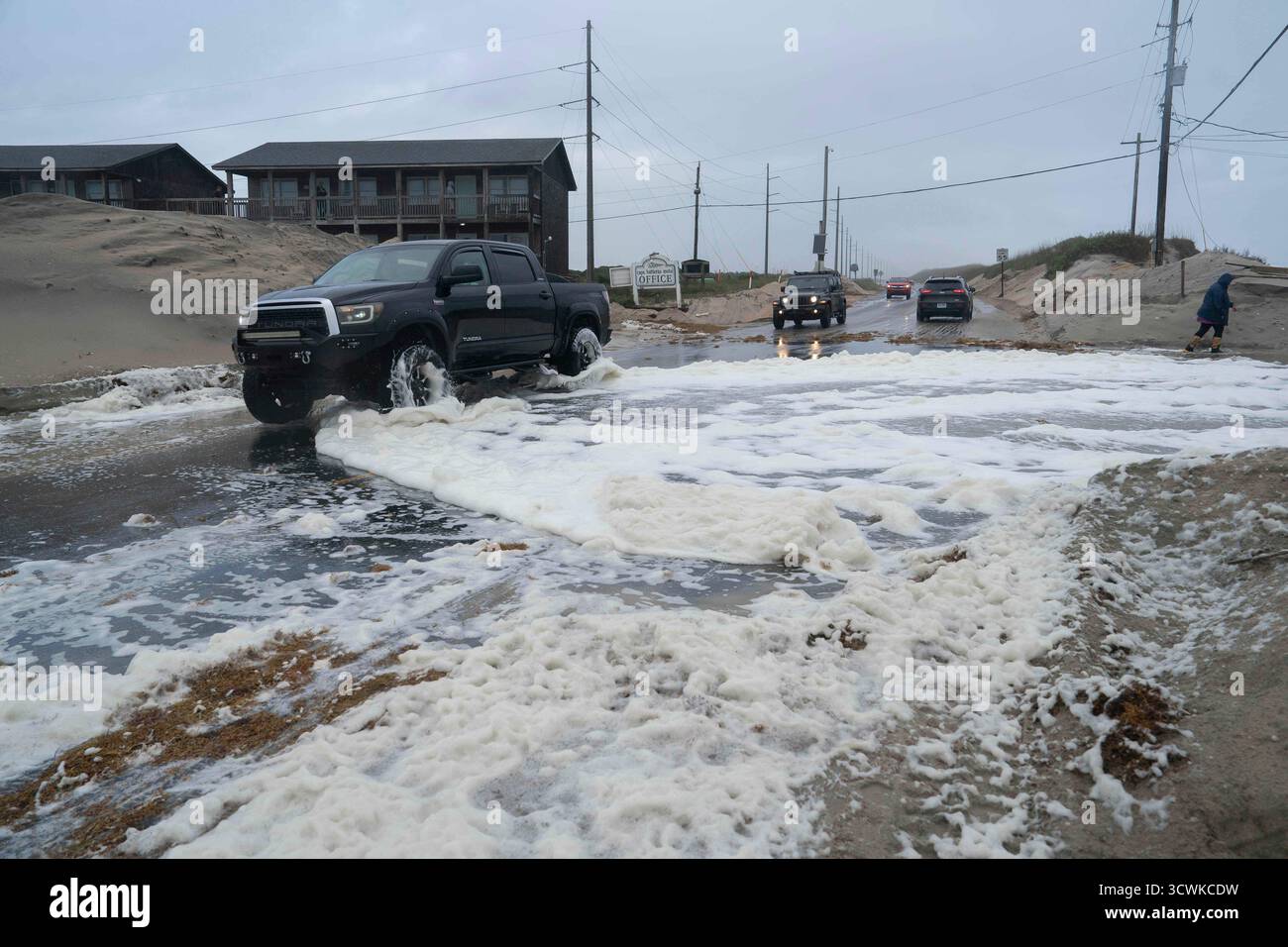 Highway 12 is flooded in the midst of a storm, Sunday, Oct. 12, 2025 ...