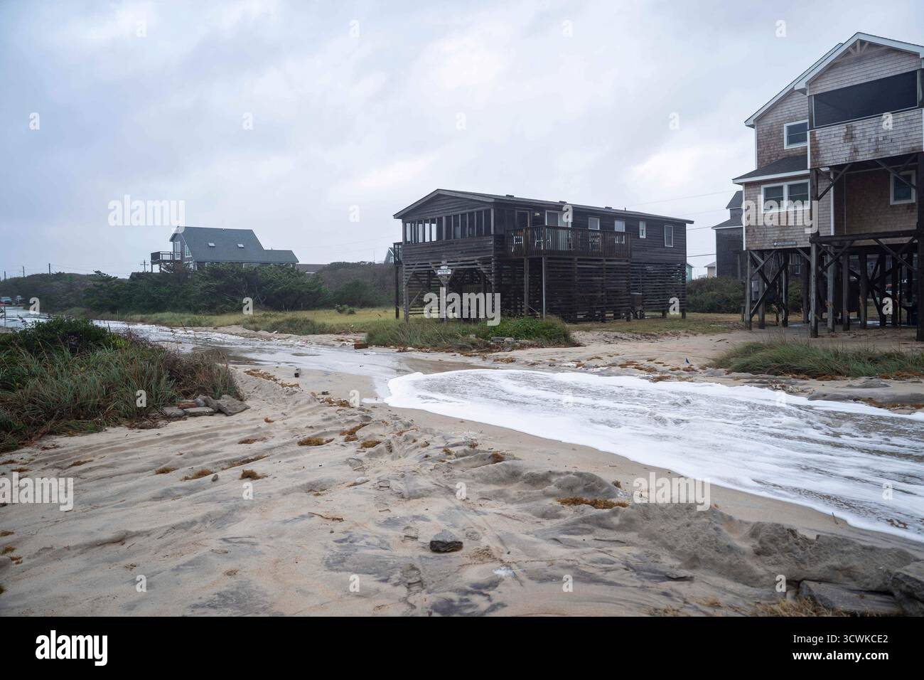 A road floods in the midst of a storm, Sunday, Oct. 12, 2025, in Buxton ...