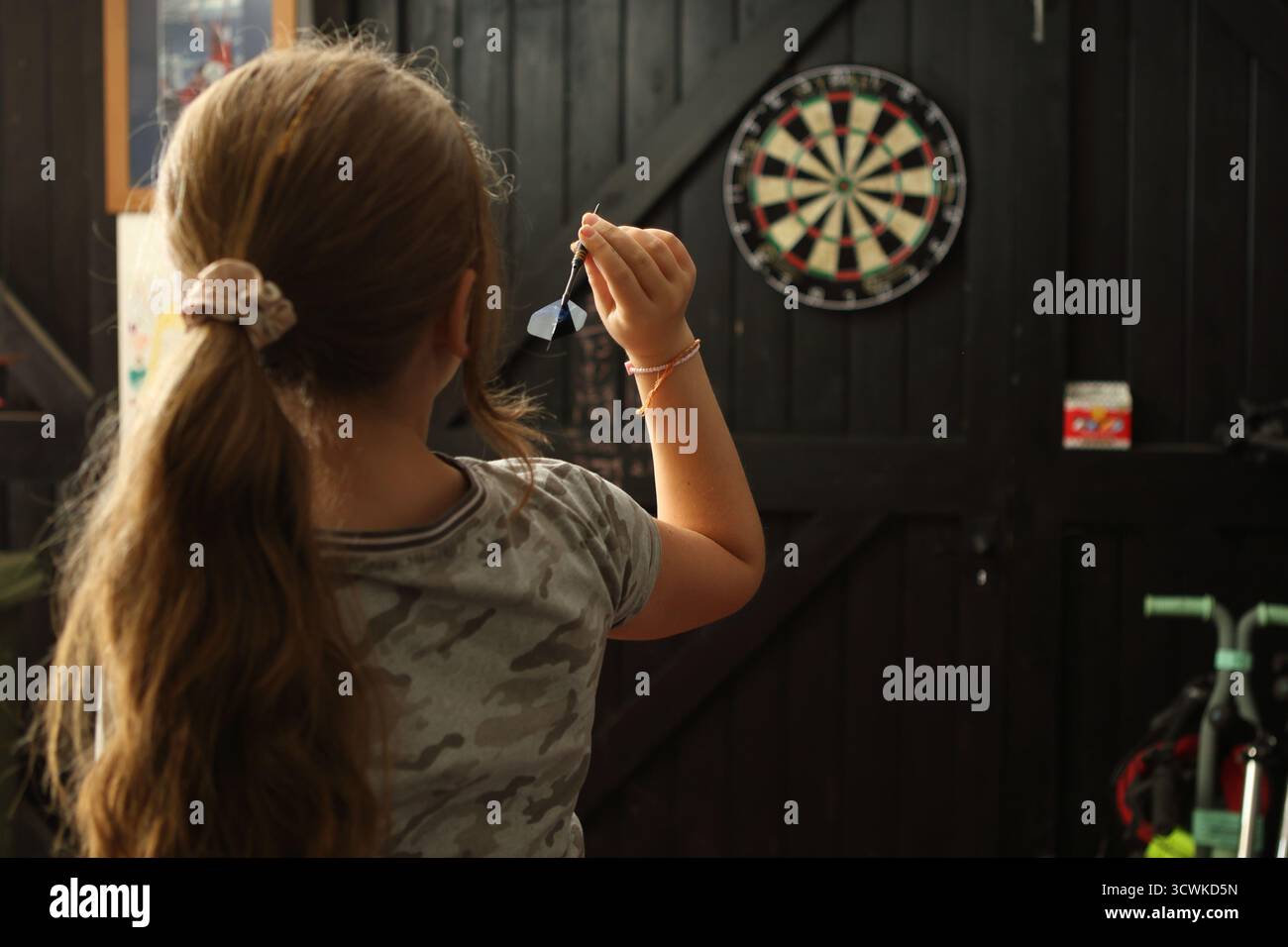 Girl throwing darts target hi-res stock photography and images - Alamy