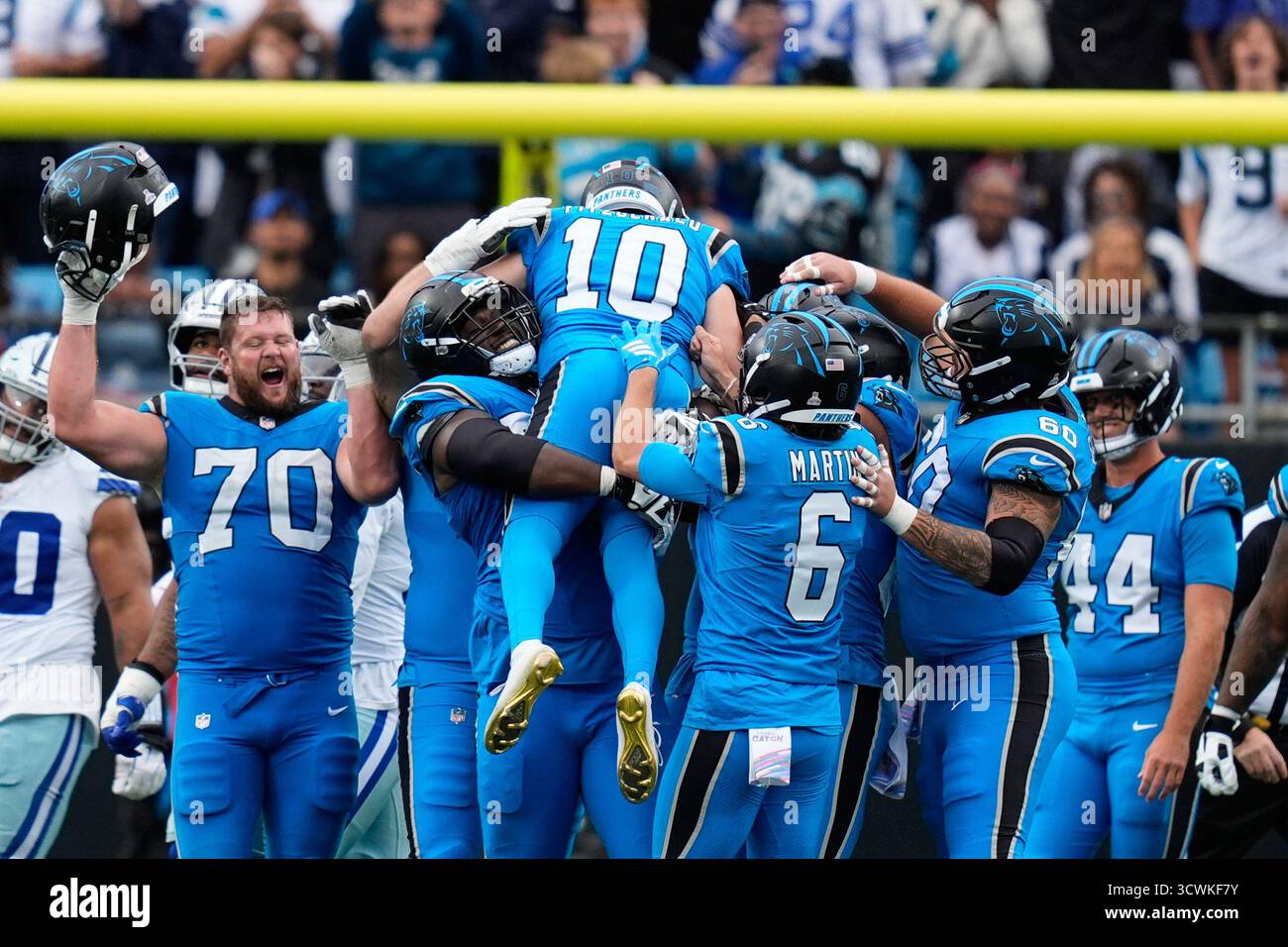 Carolina Panthers kicker Ryan Fitzgerald (10) is lifted by teammates ...