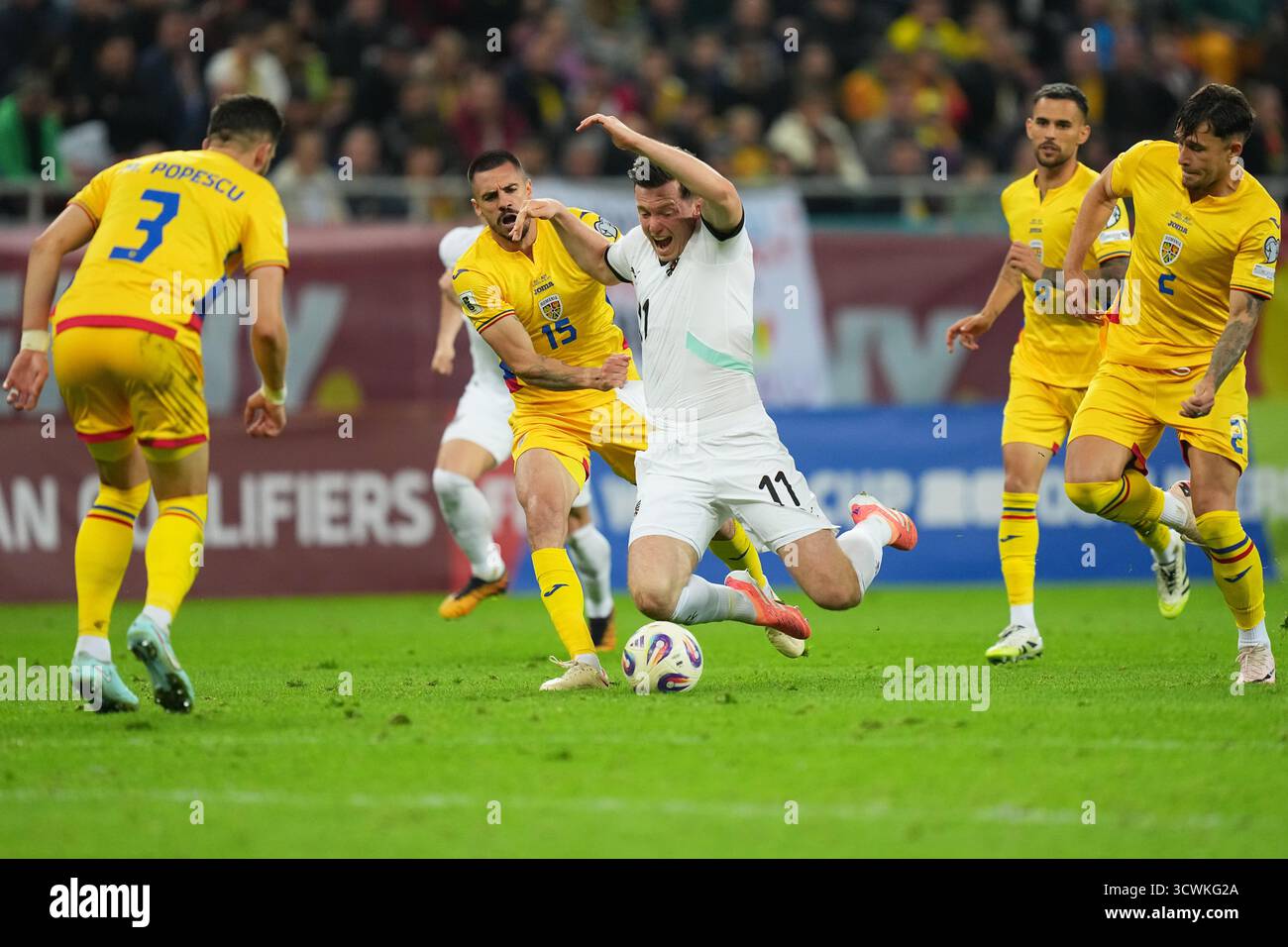 Austria's Michael Gregoritsch is fouled by Romania's Andrei Burca ...
