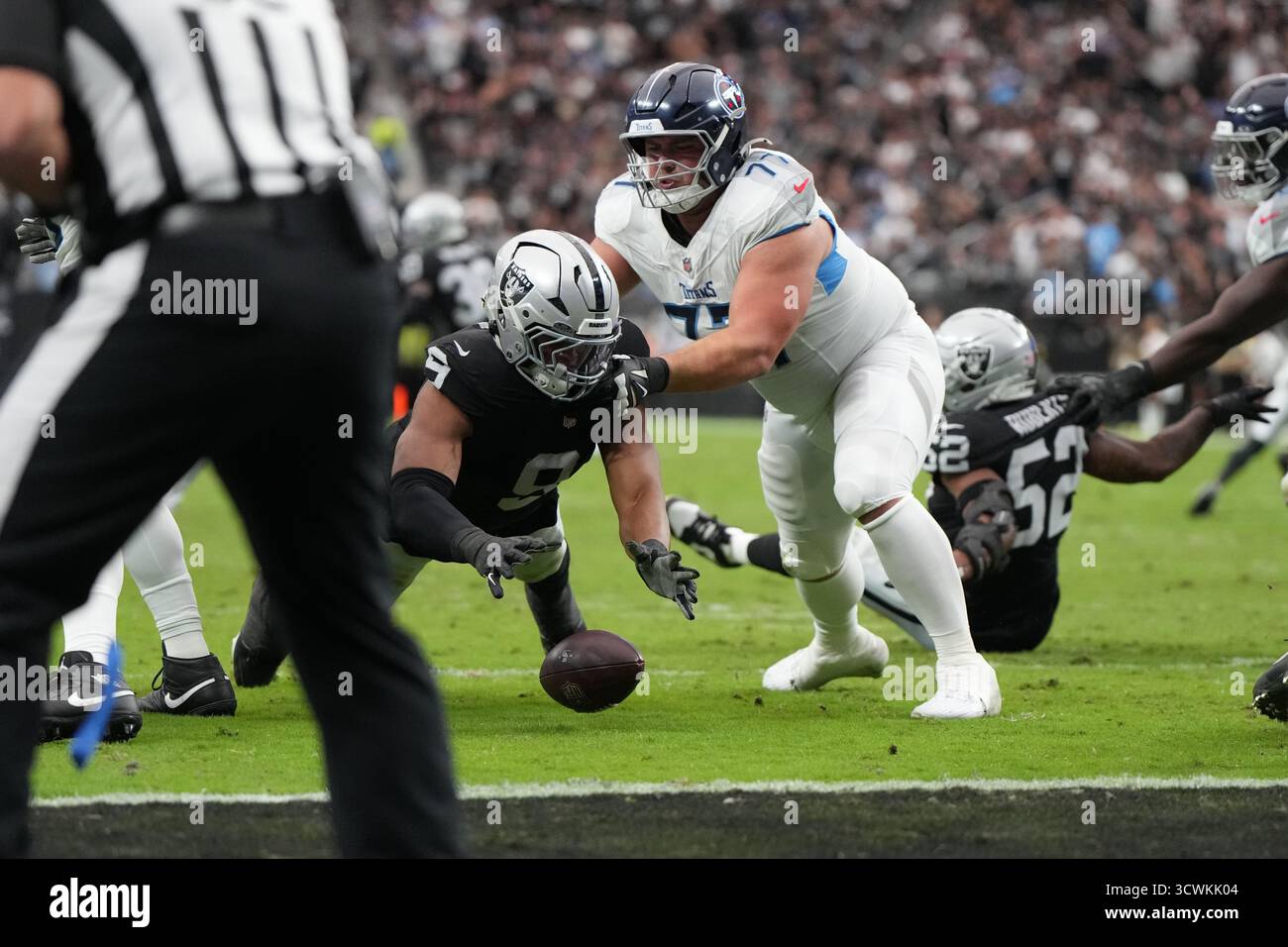 Las Vegas Raiders defensive end Tyree Wilson (9) recovers a fumble by ...