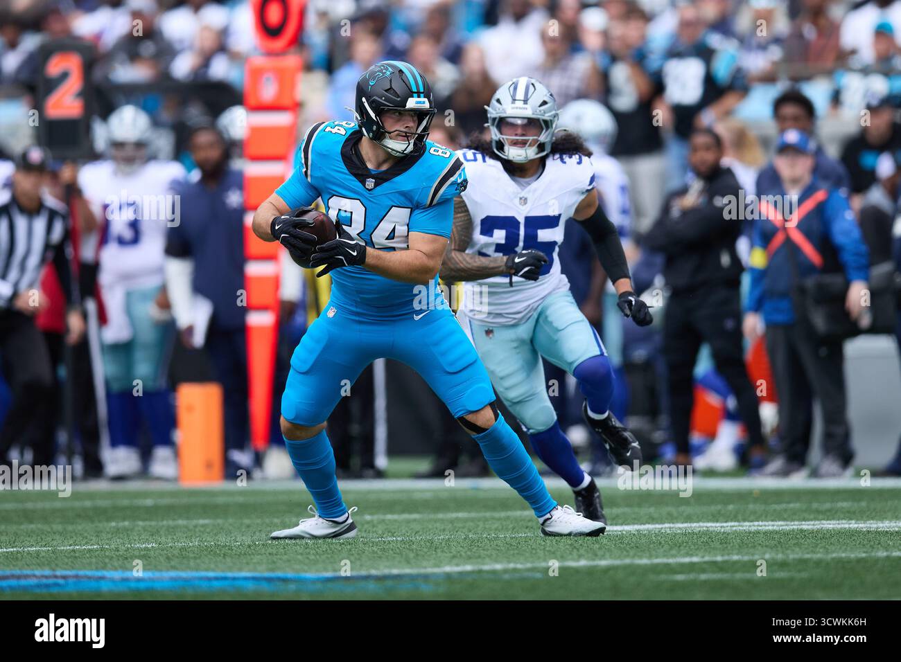 Carolina Panthers tight end Mitchell Evans (84) turns up field after ...