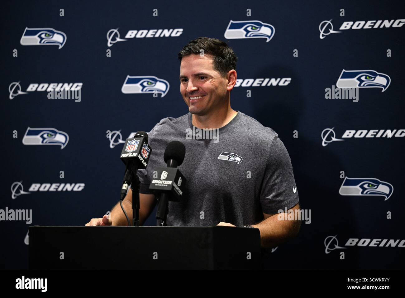Seattle Seahawks head coach Mike Macdonald talks with reporters after ...