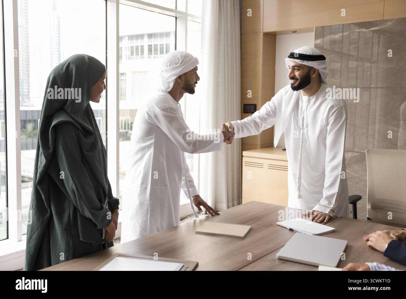 Muslim corporate boss handshake with new worker hired for job Stock ...