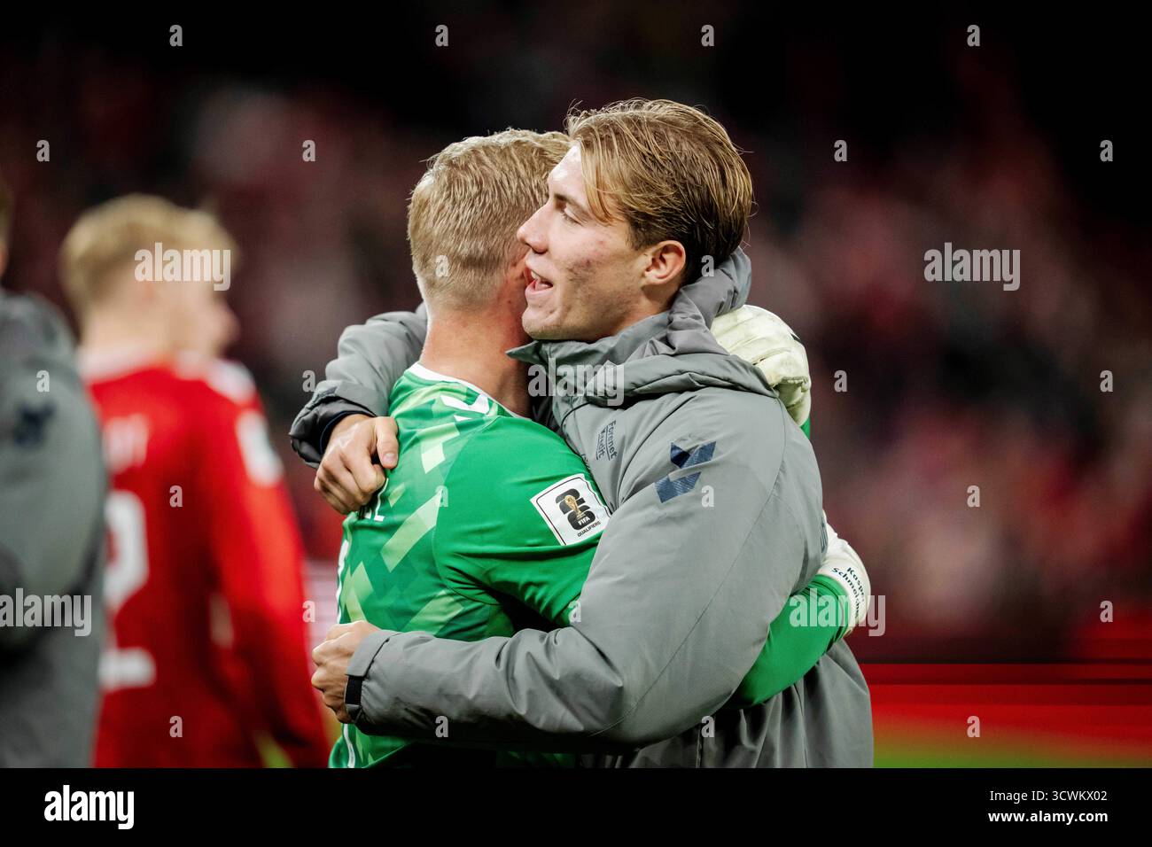 Denmark's Kasper Schmeichel and Rasmus Hoejlund embrace after the World ...