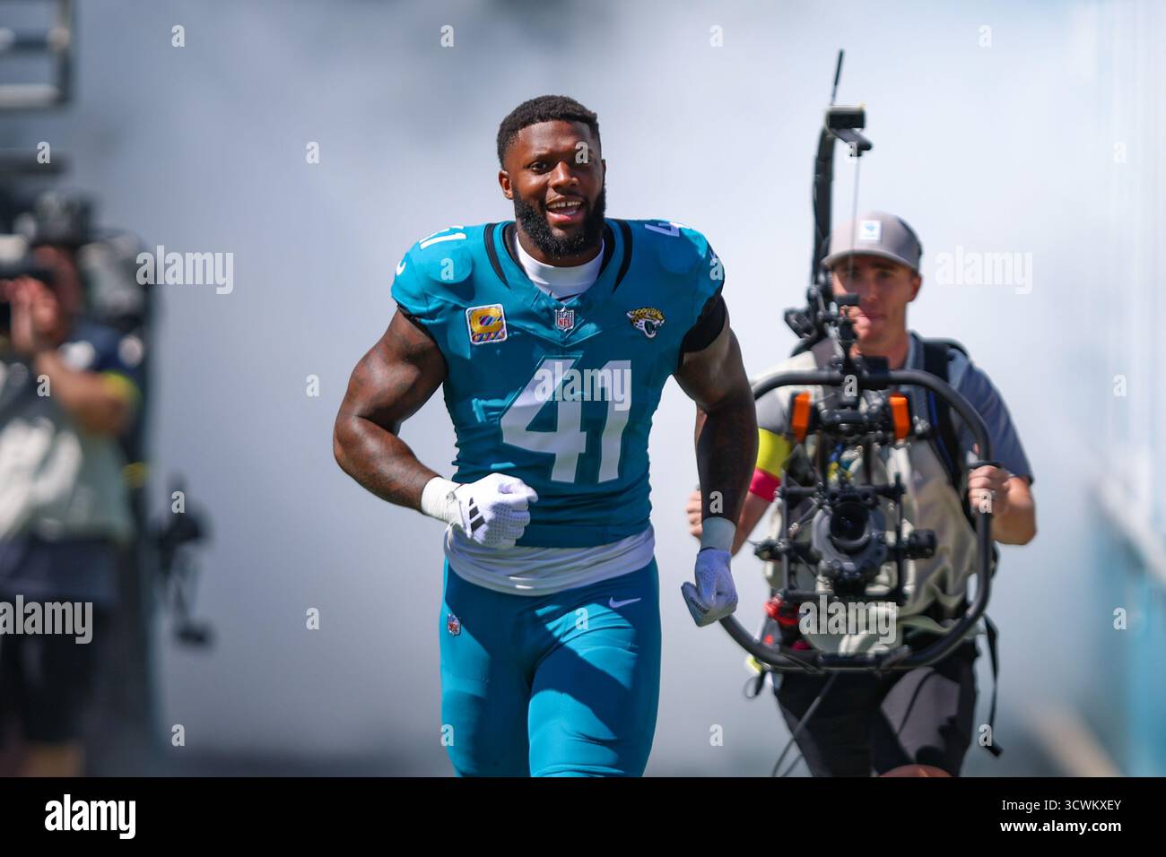 Jacksonville Jaguars defensive end Josh Hines-Allen (41) runs onto the ...