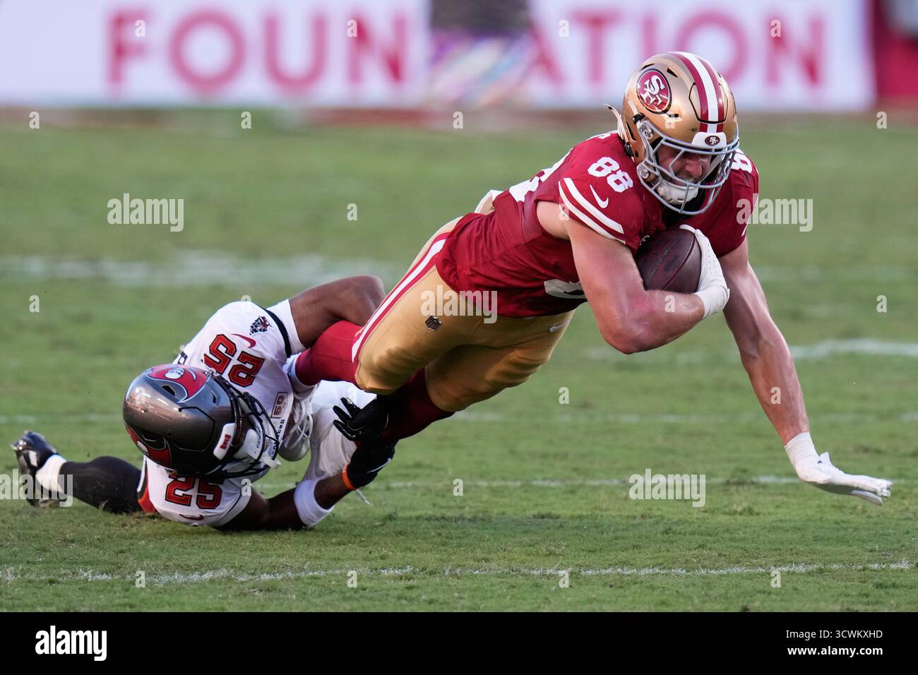 San Francisco 49ers tight end Jake Tonges (88) is tackled by Tampa Bay ...