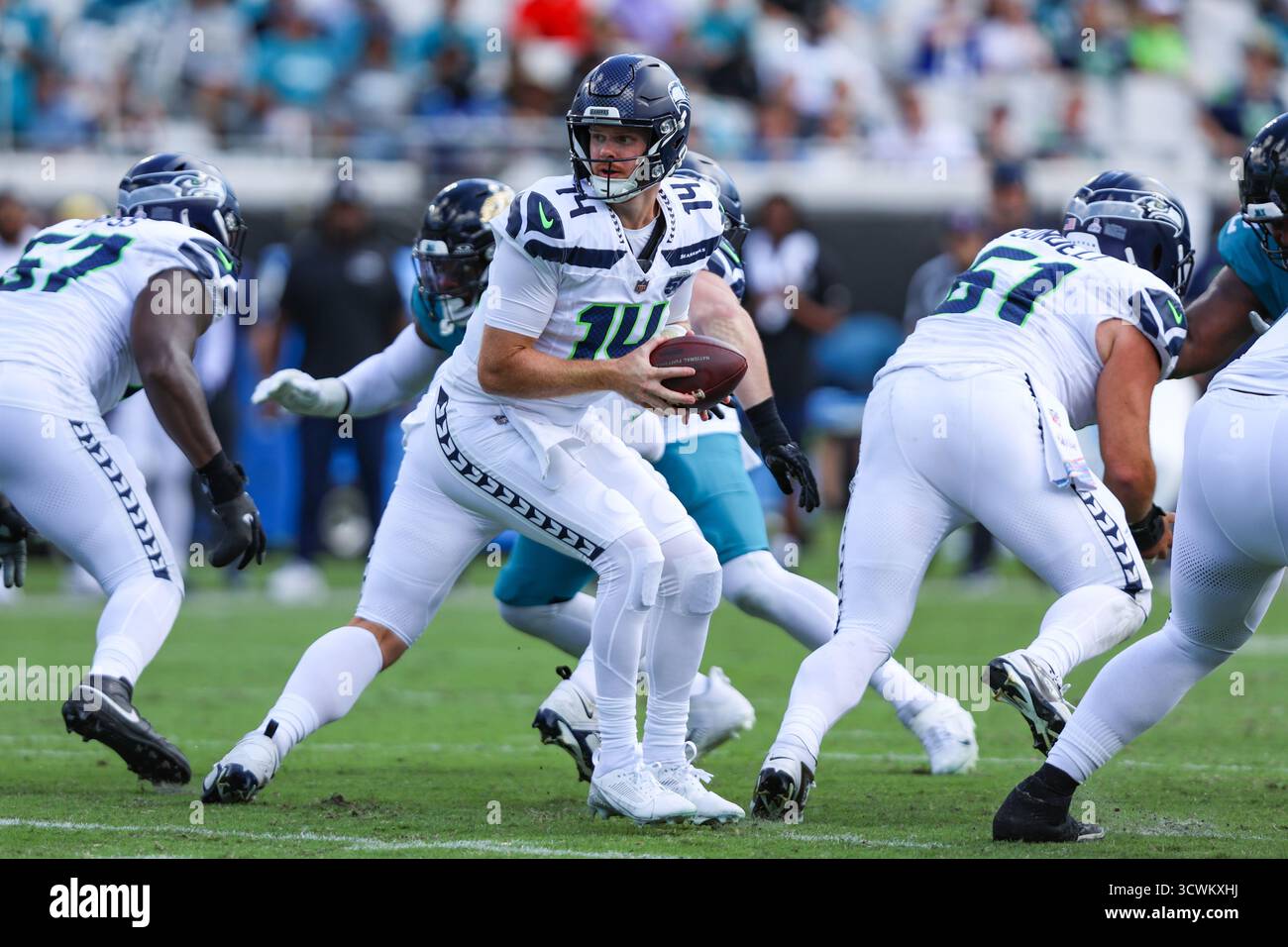 Seattle Seahawks quarterback Sam Darnold (14) looks to his backfield ...