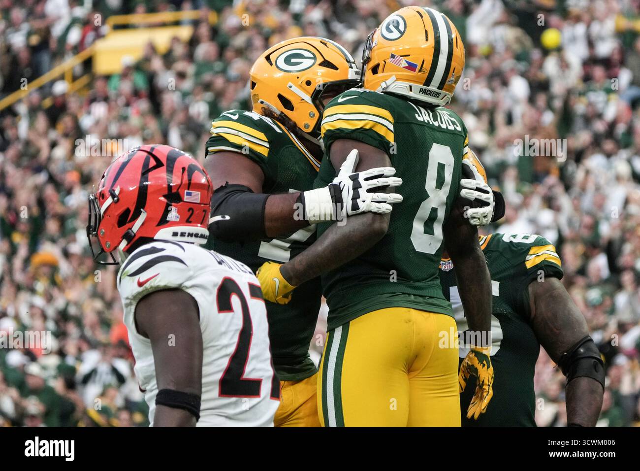 Green Bay Packers running back Josh Jacobs (8) celebrates his touchdown ...