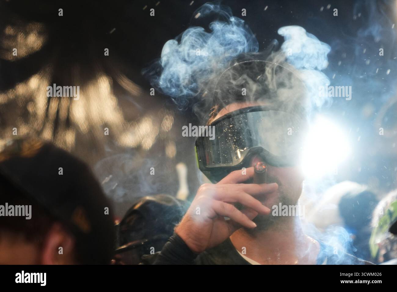 Seattle Mariners catcher Cal Raleigh smokes a cigar as he celebrates ...
